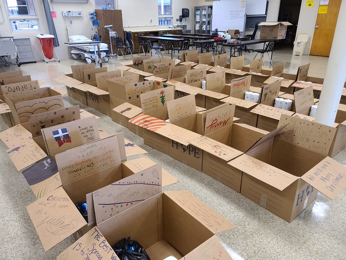 CATA students box up food, love, compassion for families in need - The ...