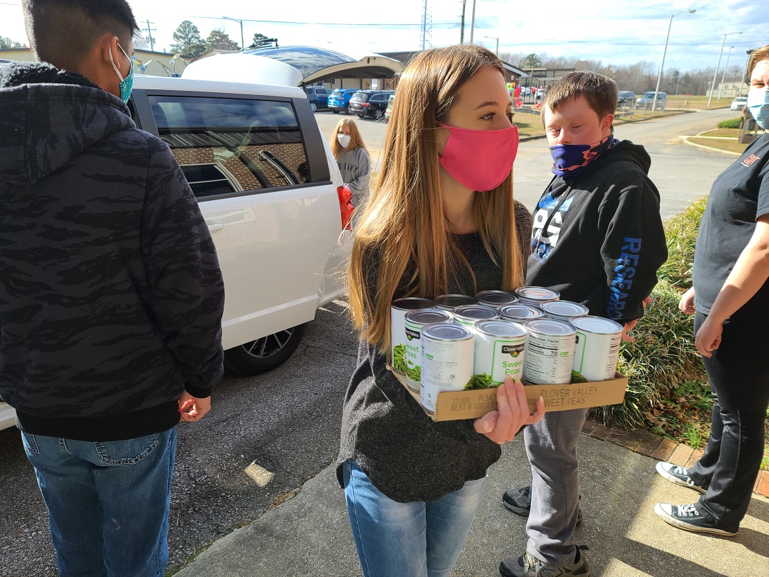 CATA students box up food, love, compassion for families in need - The ...