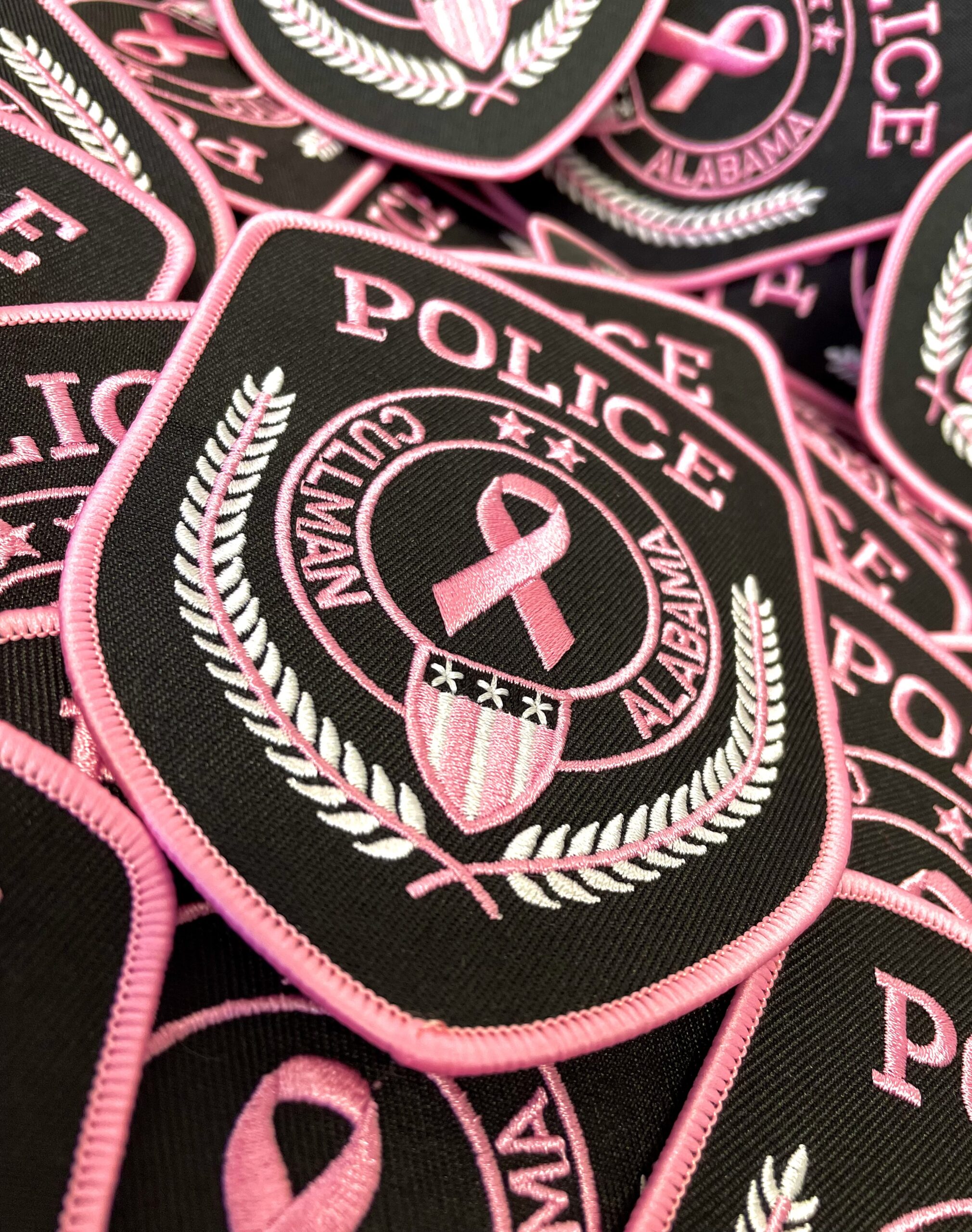 CPD selling, sporting breast cancer awareness patches - The Cullman Tribune